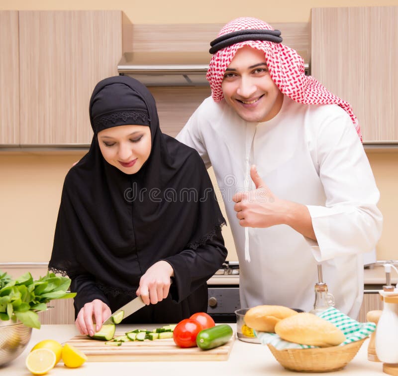 Young Arab Family in the Kitchen Stock Photo - Image of couple, eating ...