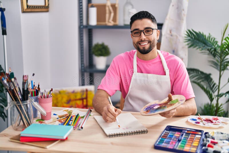 Young Arab Man Artist Smiling Confident Drawing on Notebook at Art ...