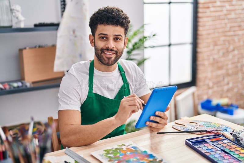 Young Arab Man Artist Smiling Confident Using Touchpad at Art Studio ...
