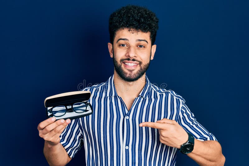 Young Arab Man With Beard Holding Glasses In Eyewear Case Smiling Happy