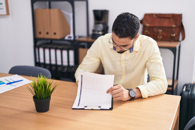 Young Arab Man Business Worker Writing on Document Working at Office ...