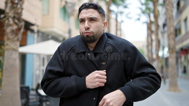 Young Arab Man Covering with Jacket for Cold at Street Stock Image ...