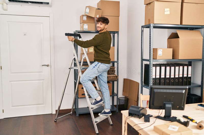 Young Arab Man Ecommerce Business Worker Holding Package Standing on ...