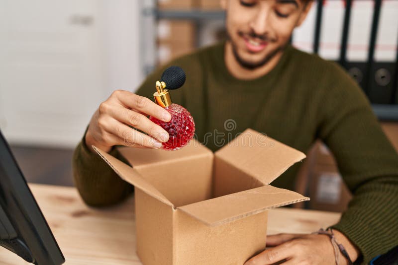 Young Arab Man Ecommerce Business Worker Packing Perfume at Office ...