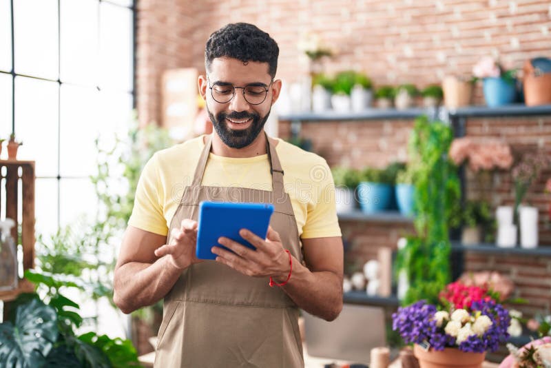 Young Arab Man Florist Smiling Confident Using Touchpad at Florist ...