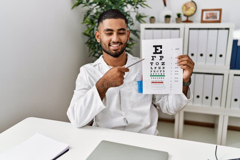 Young Arab Man Holding Sneller Test at Clinic Stock Photo - Image of ...