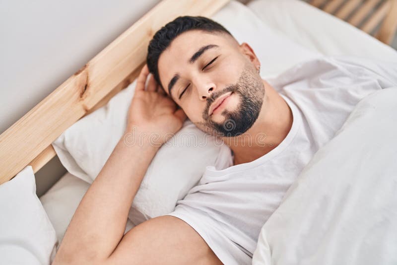Young Arab Man Lying on Bed Sleeping at Bedroom Stock Photo - Image of ...