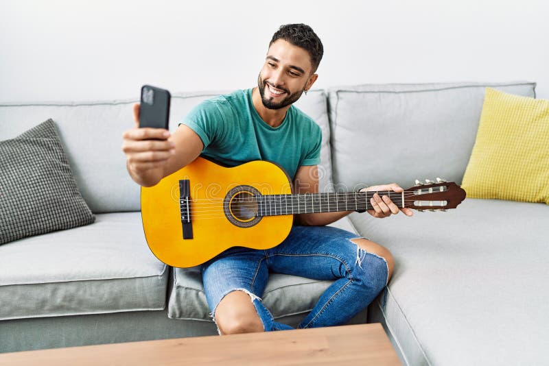 Young Arab Man Make Selfie by the Smartphone Playing Classical Guitar ...
