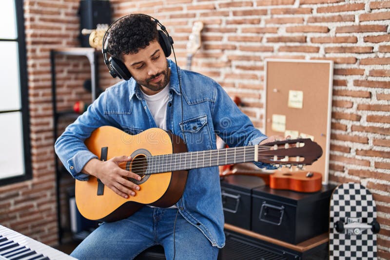 Young Arab Man Musician Playing Classical Guitar at Music Studio Stock ...