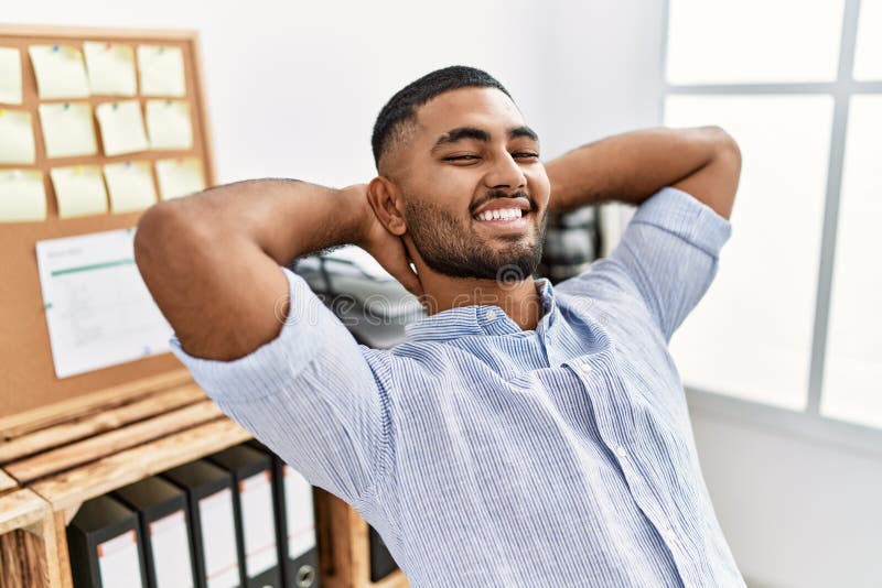 Young Arab Man Relaxed with Hands on Head Working at Office Stock Image ...