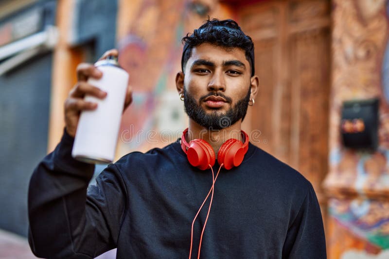 Young Arab Man Relaxed Holding Graffiti Spray at Street Stock Photo ...