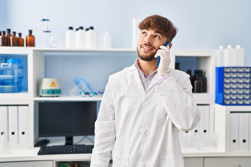 Young Arab Man Scientist Smiling Confident Talking on Smartphone at ...
