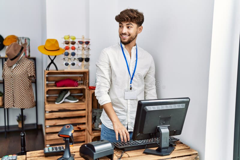 Young Arab Man Shopkeeper Smiling Confident Working at Clothing Store ...