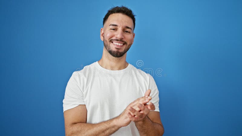 Young Arab Man Smiling Confident Clapping Hands Over Isolated Blue ...