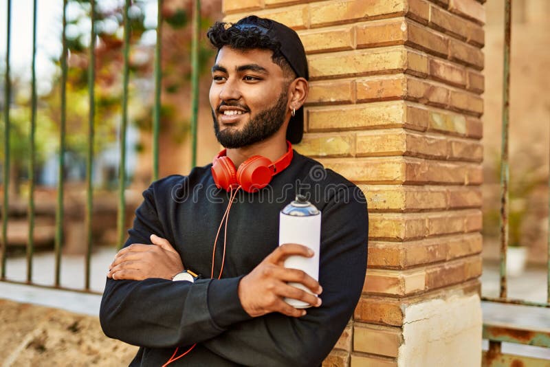 Young Arab Man Smiling Confident Holding Graffiti Spray at Street Stock ... Young Arab Man Smiling Confident Holding Graffiti Spray at Street Stock ...