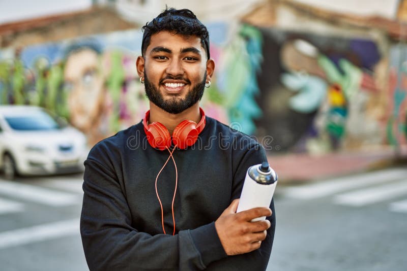 Young Arab Man Smiling Confident Holding Graffiti Spray at Street Stock ...