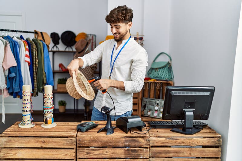 Young Arab Man Smiling Confident Scanning Hat Using Barcode Reader at ...