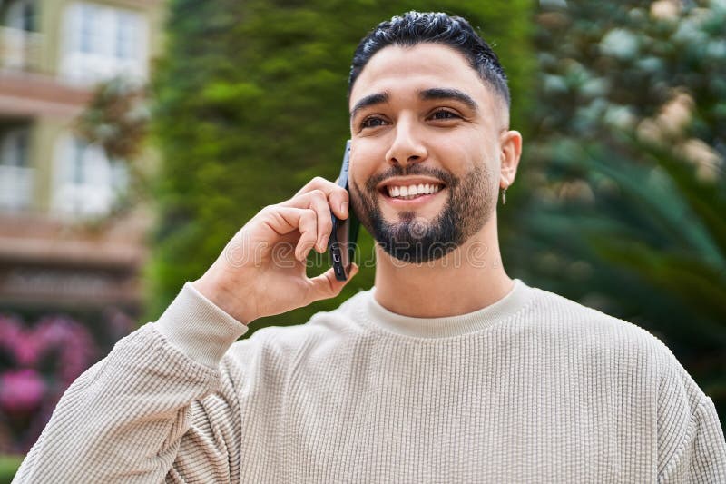 Young Arab Man Smiling Confident Talking on the Smartphone at Park ...