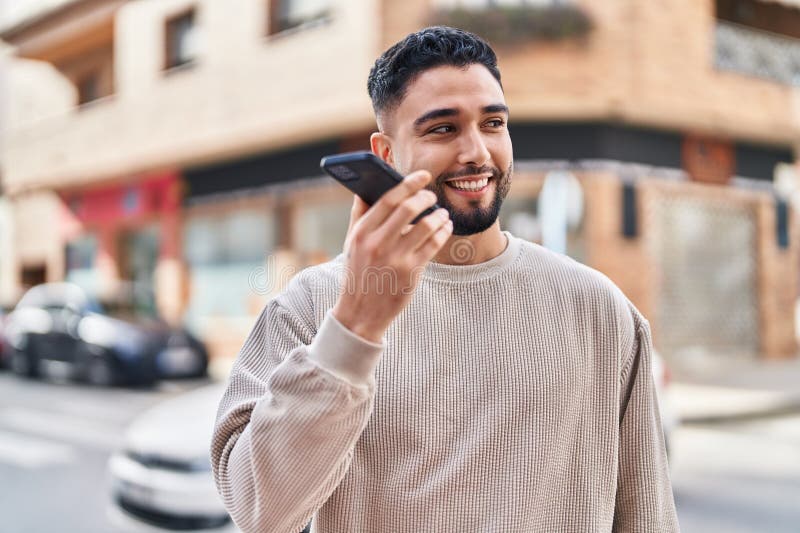 Young Arab Man Smiling Confident Talking on the Smartphone at Street ...