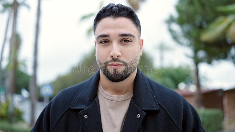 Young Arab Man Standing with Serious Expression at Street Stock Image ...