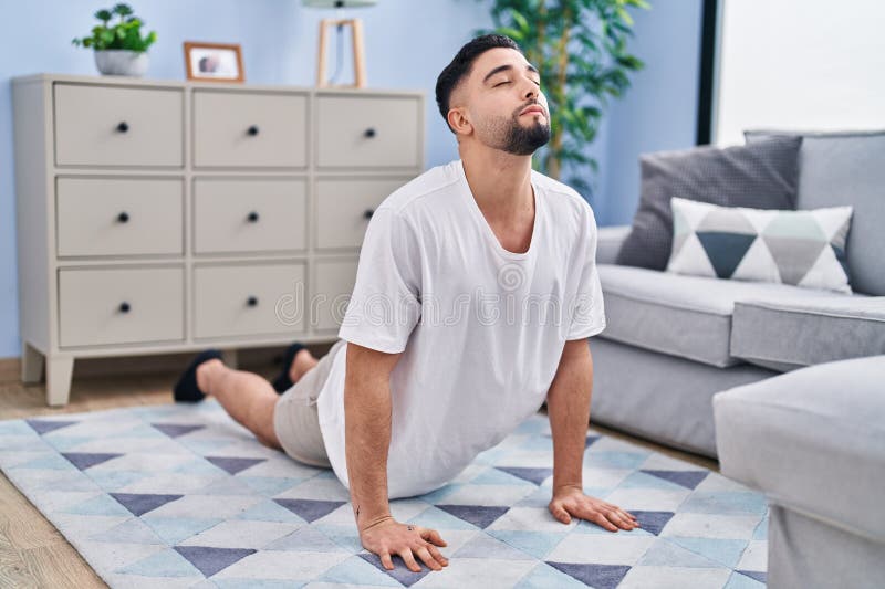 Young Arab Man Stretching at Home Stock Photo - Image of training ...