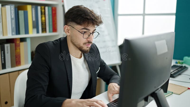 Young Arab Man Student Using Computer Studying at University Classroom ...
