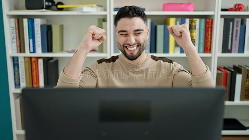 Young Arab Man Student Using Computer Studying at University Classroom ...