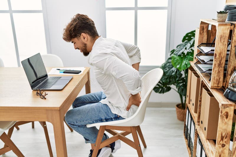 Young Arab Man Suffering for Back Pain Working at Office Stock Image ...