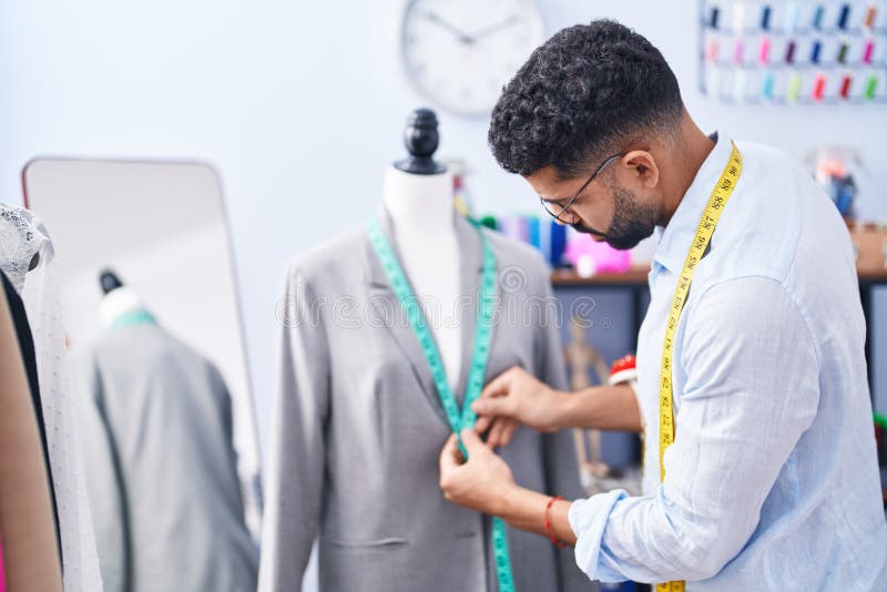 Young Arab Man Tailor Measuring Jacket at Tailor Shop Stock Photo ...