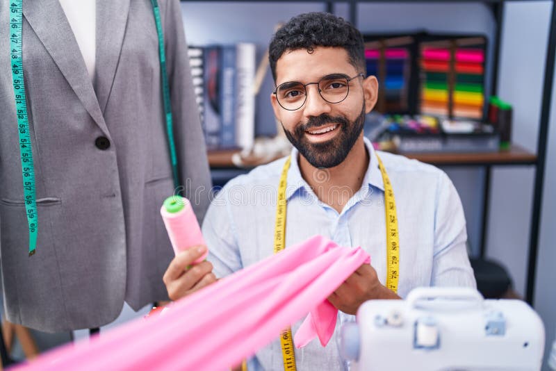 Young Arab Man Tailor Smiling Confident Holding Cloth and Thread at ...