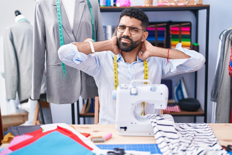 Young Arab Man Tailor Stressed Using Sewing Machine at Tailor Shop ...
