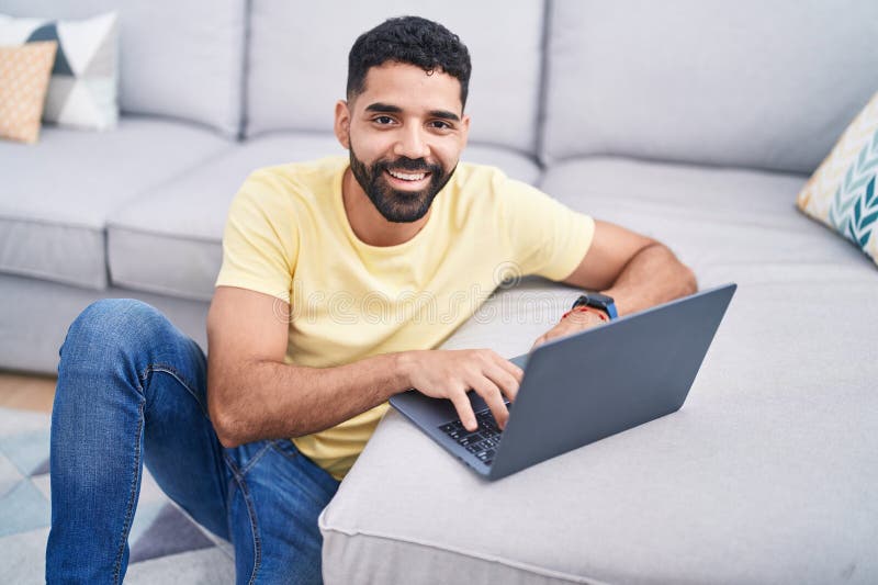 Young Arab Man Using Laptop Sitting on Floor at Home Stock Image ...