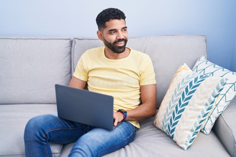 Young Arab Man Using Laptop Sitting on Table at Home Stock Image ...