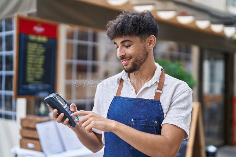 Young Arab Man Waiter Holding Data Phone Working at Restaurant Stock ...