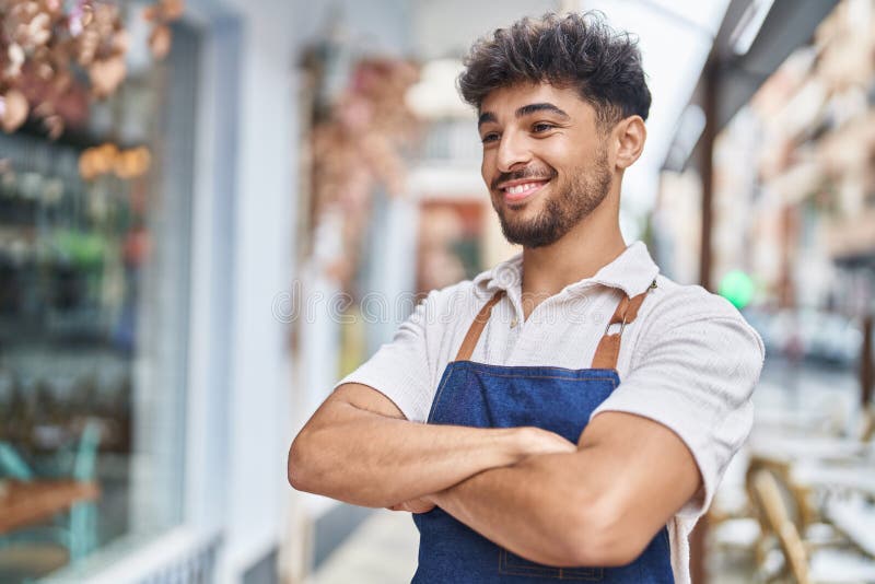 Young Arab Man Waiter Standing with Arms Crossed Gesture at Restaurant ...