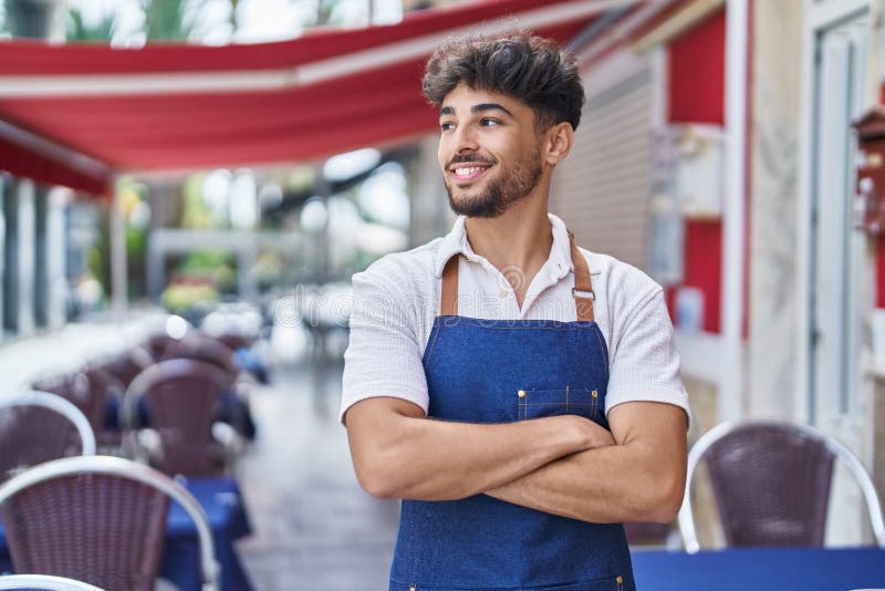 Young Arab Man Waiter Standing with Arms Crossed Gesture at Restaurant ...