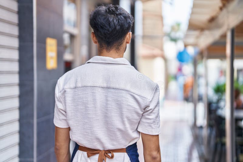 Young Arab Man Waiter Standing on Back View at Restaurant Stock Photo ...