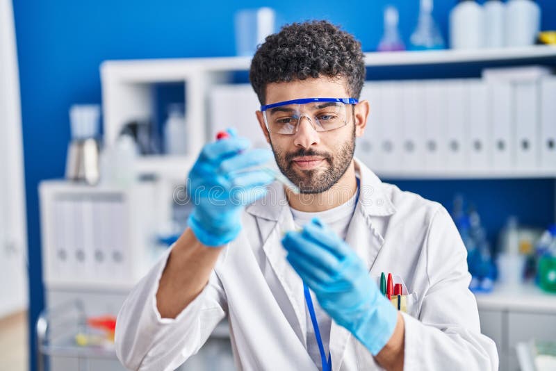 Young Arab Man Wearing Scientist Uniform Working at Laboratory Stock ...