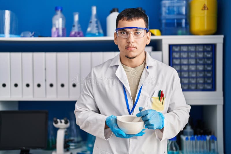 Young Arab Man Working at Scientist Laboratory Relaxed with Serious ...