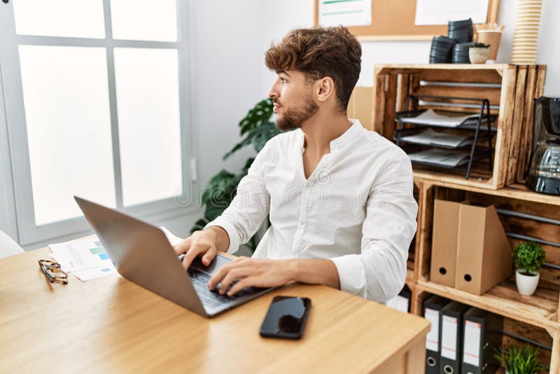 Young Arab Man Working Using Computer Laptop at the Office Looking To ...