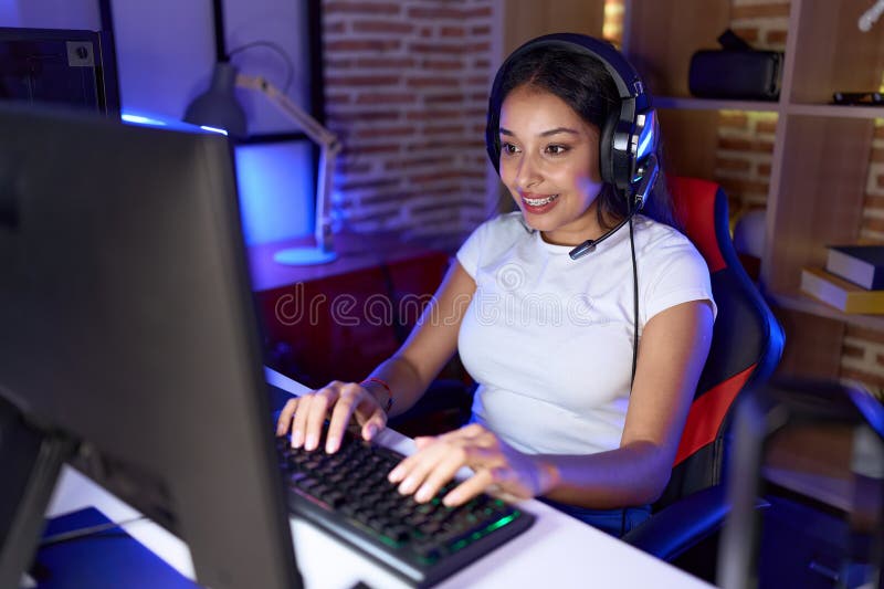 Young Arab Woman Streamer Playing Video Game Using Computer at Gaming ...