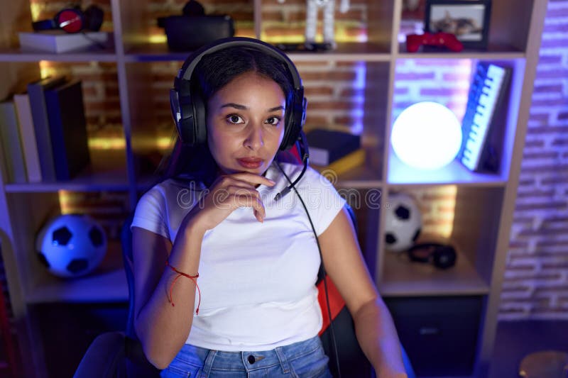 Young Arab Woman Streamer Sitting Table with Serious Expression at ...