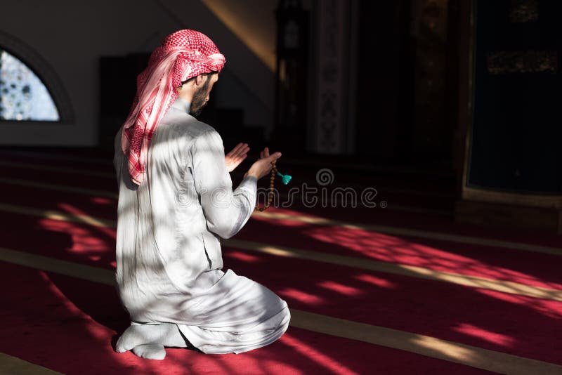 Young Arabic Muslim Man Praying. Doing a Dailly Pray Inside Modern ...