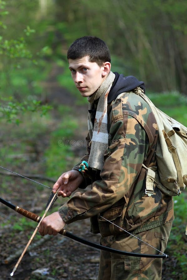 Young archer in forest stock photo. Image of green, kill - 71748302