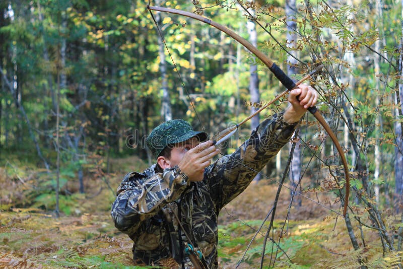 Young archer in forest stock image. Image of forester - 71826223