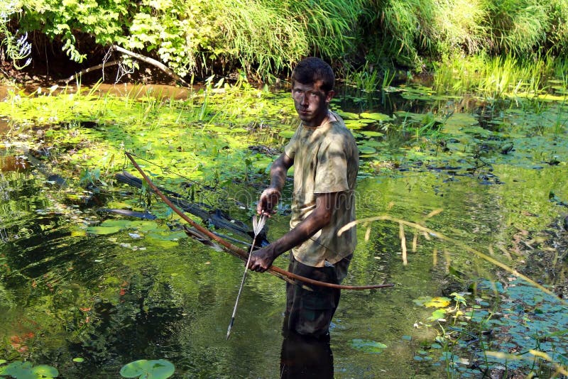 Young archer in forest stock photo. Image of hunt, water - 71827538