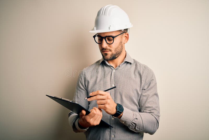 Young Architect Inspector Man Wearing Builder Safety Helmet and Using ...