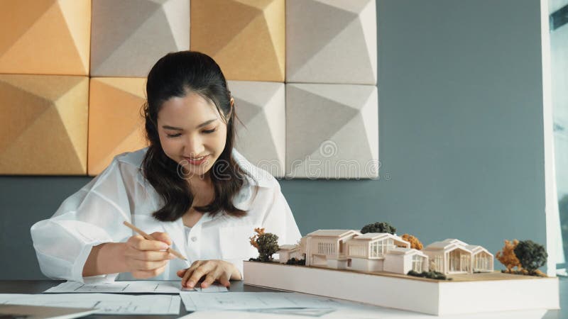 Young Architect Measure House Model while Taking a Note Blueprint ...