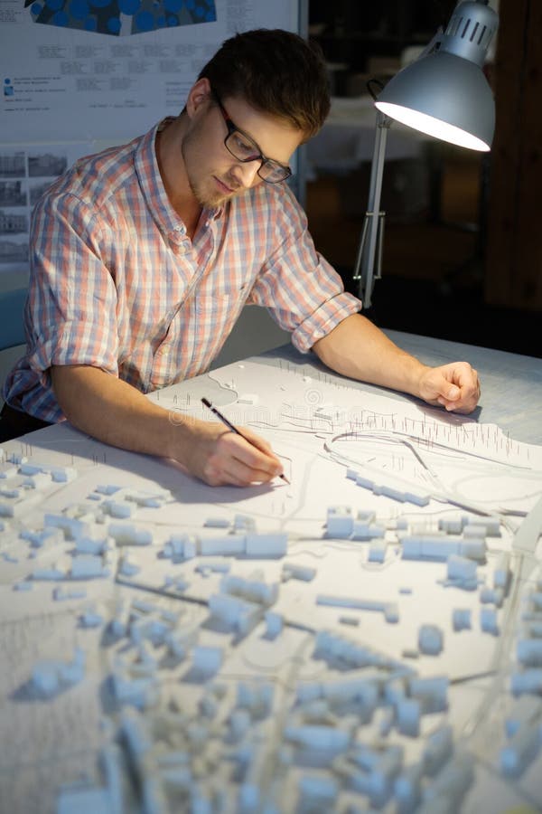 Young Architect Working on Drawing Table in Architect Studio. Stock ...