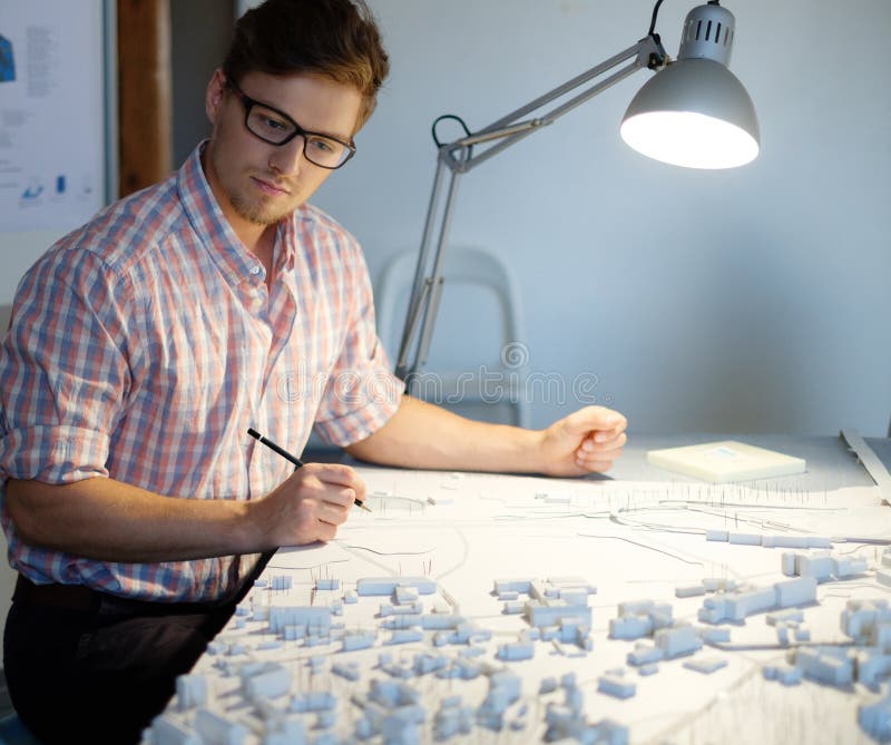 Young Architect Working on Drawing Table in Architect Studio. Stock ... Young Architect Working on Drawing Table in Architect Studio. Stock ...